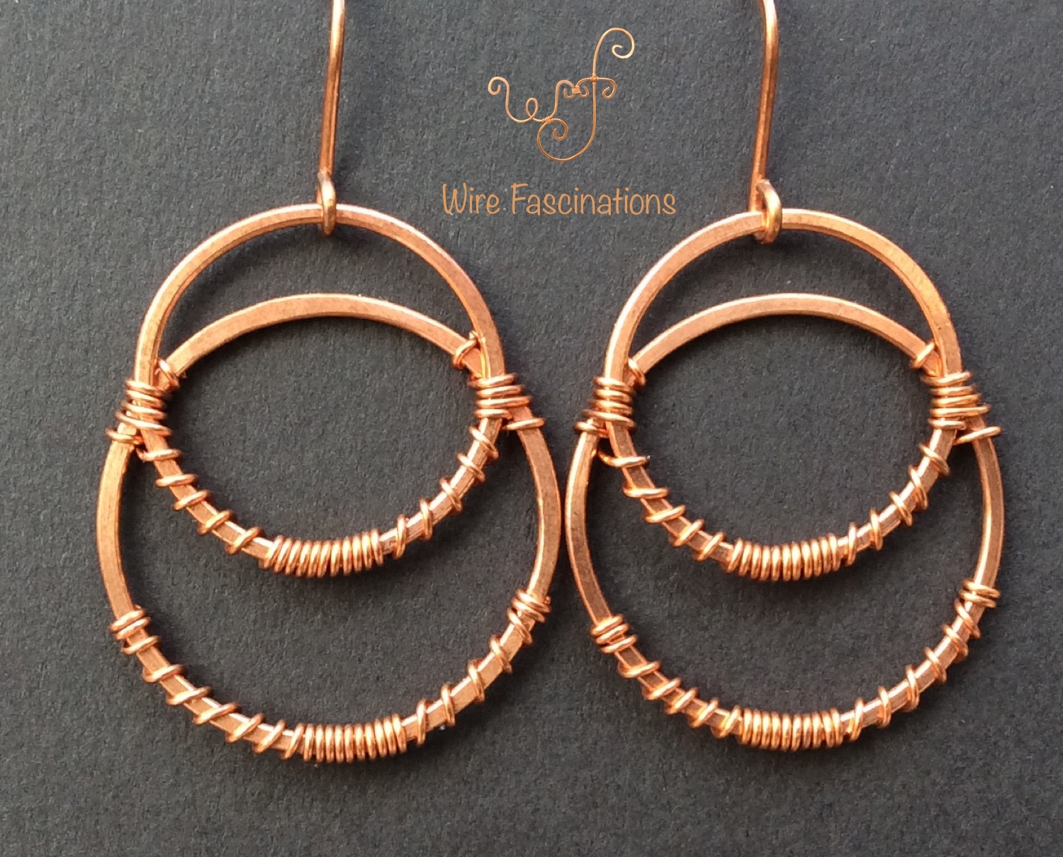 Handmade copper earrings: wire wrapped overlapping hoops - Earrings