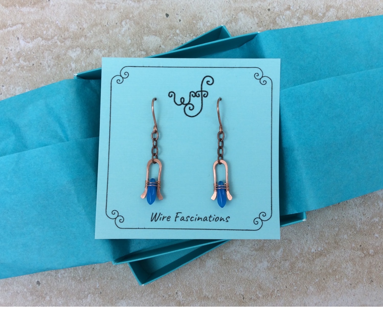 Handmade copper earrings: chain dangling wire wrapped blue glass dagger ...